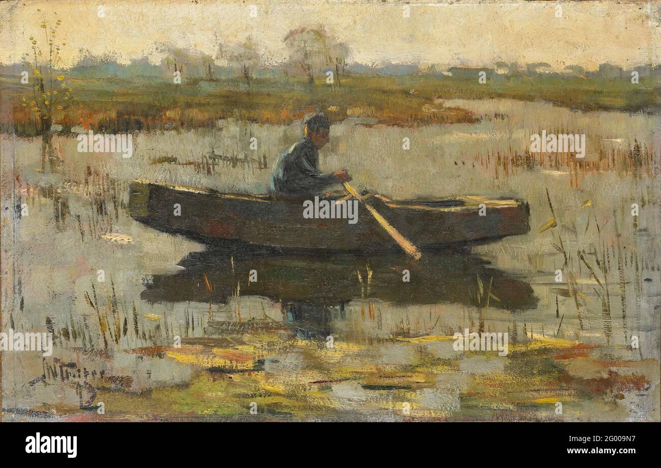 Man in a rowing boat. A man in a rowing boat in a pee area Stock Photo ...