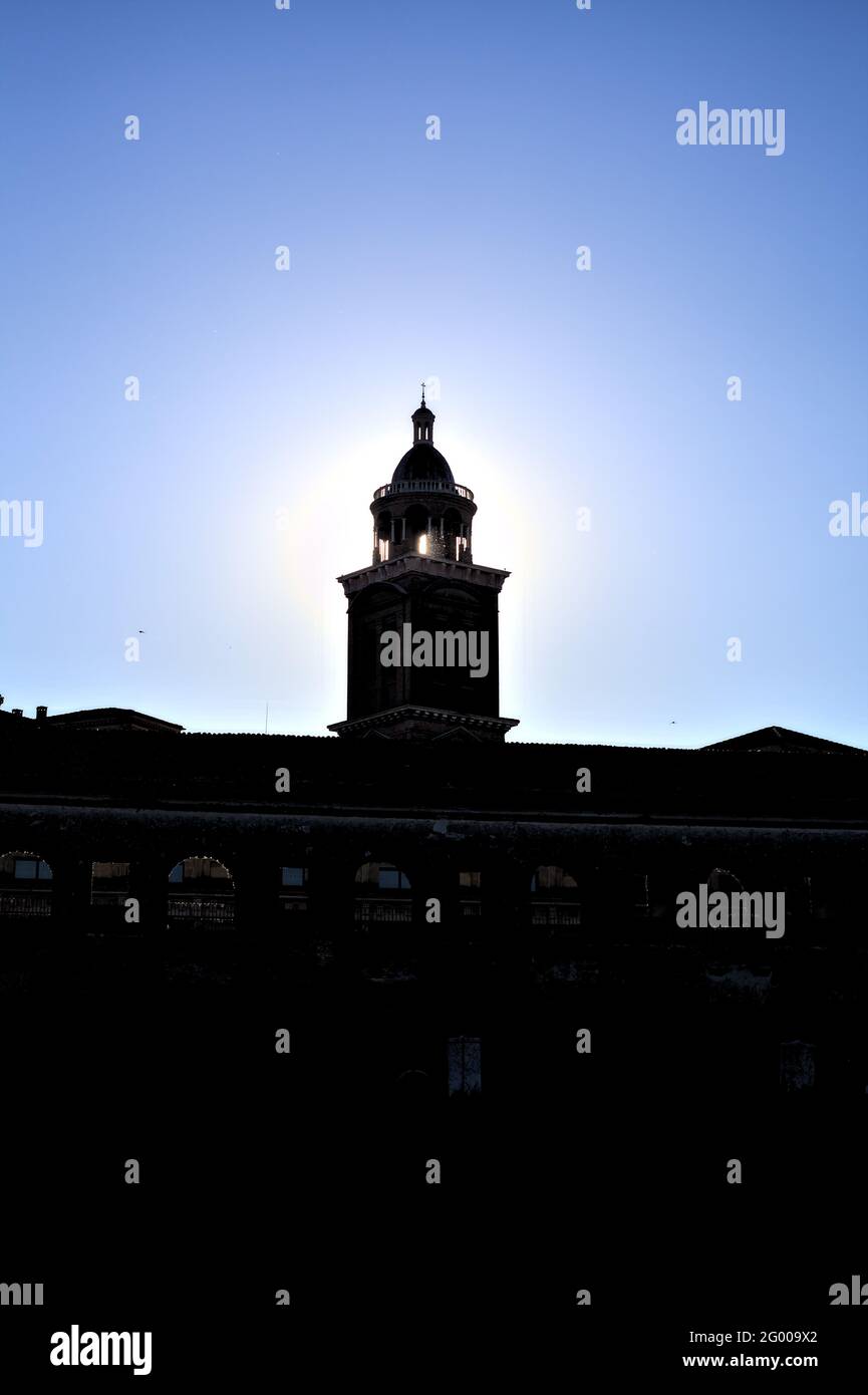 Bell tower counter lit by the sun at noon Stock Photo - Alamy