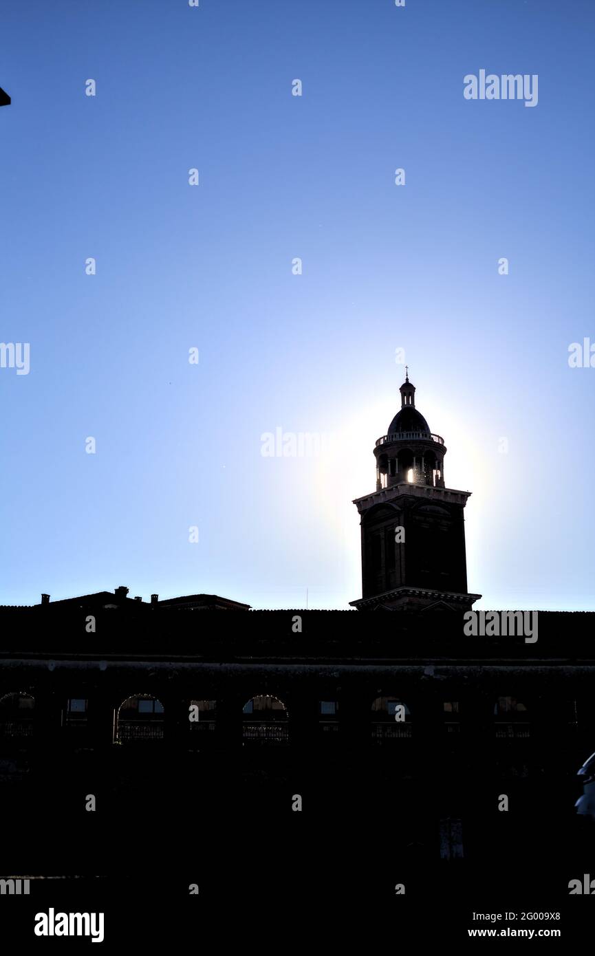 Bell tower counter lit by the sun at noon Stock Photo - Alamy
