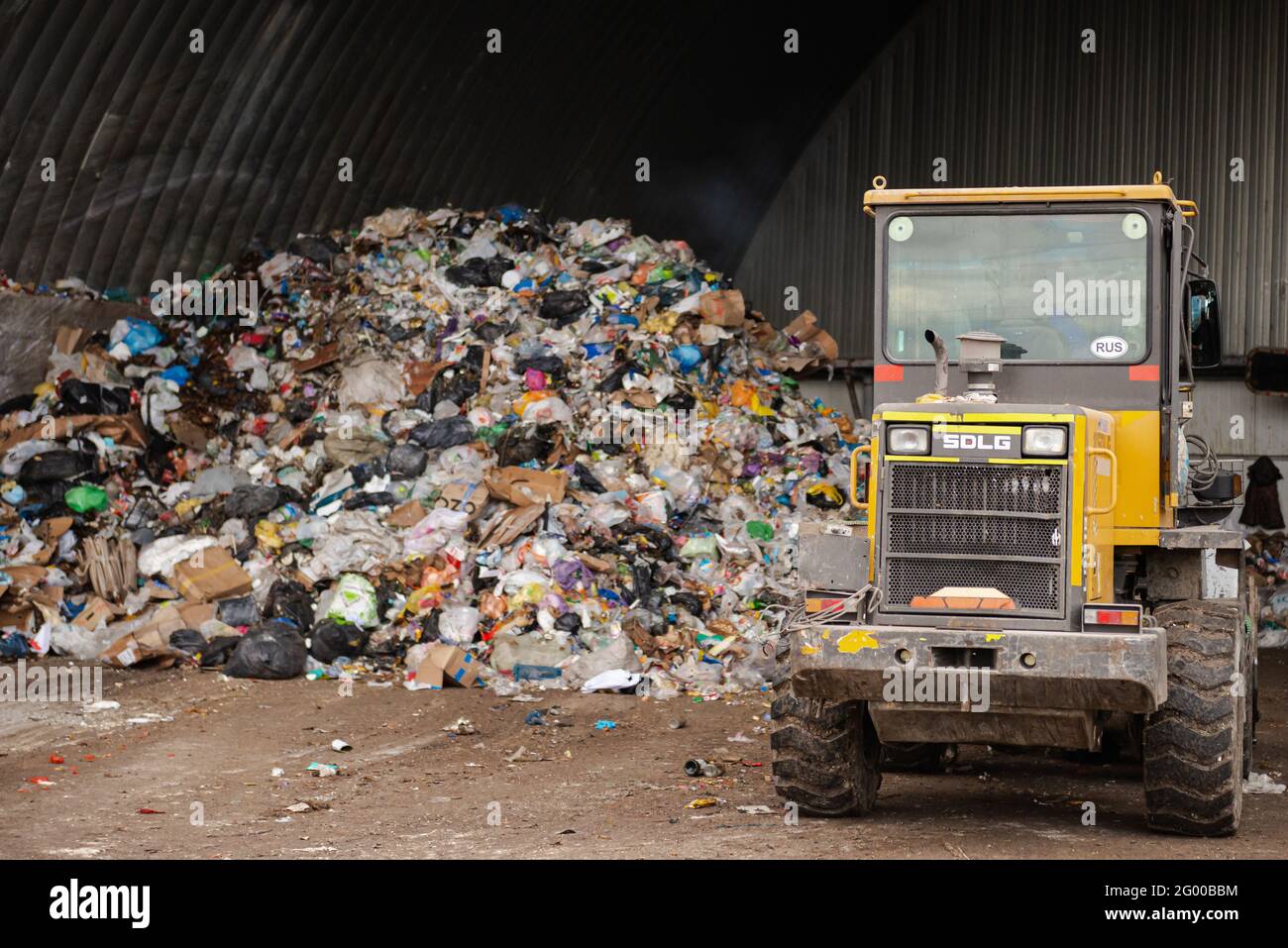 Moscow. Russia. October 2020. Garbage factory. Bulldozer near a large ...