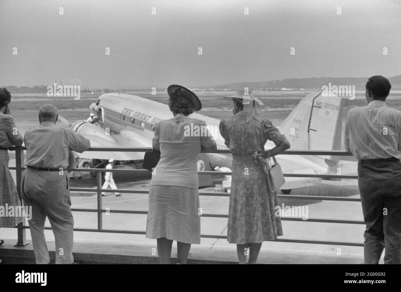 Visitors watching a plane from the observation platform at the ...