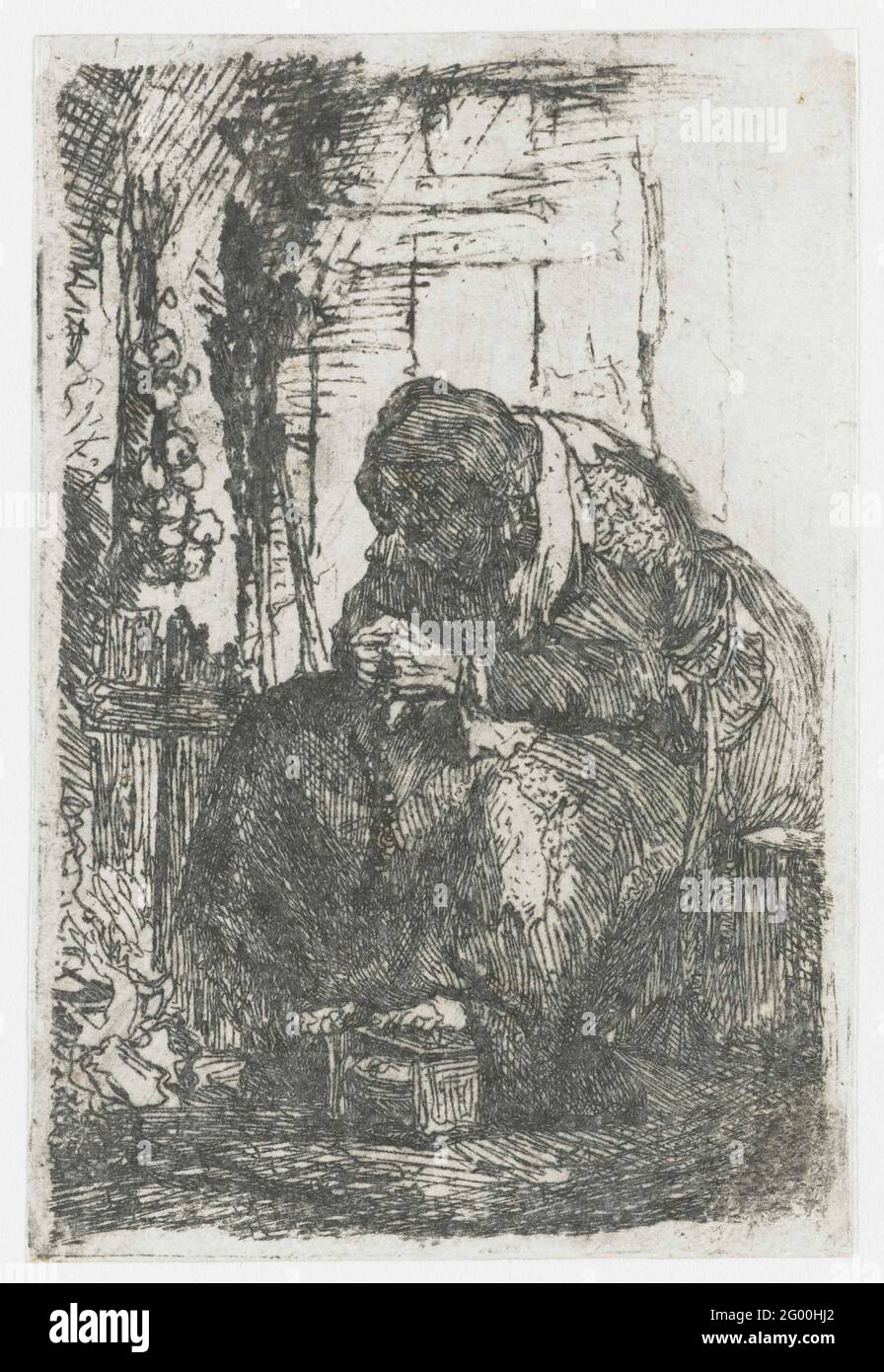 Old woman sitting in a cabin with a strand onions on the wall; The ...