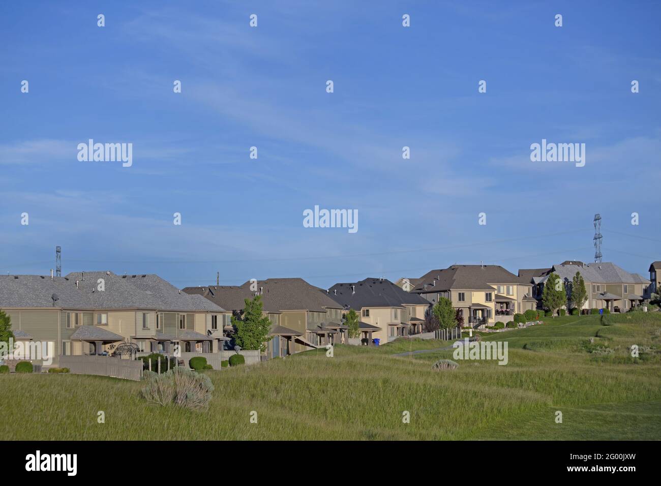 Shot of the neighborhood with green surrounding and hills area and ...