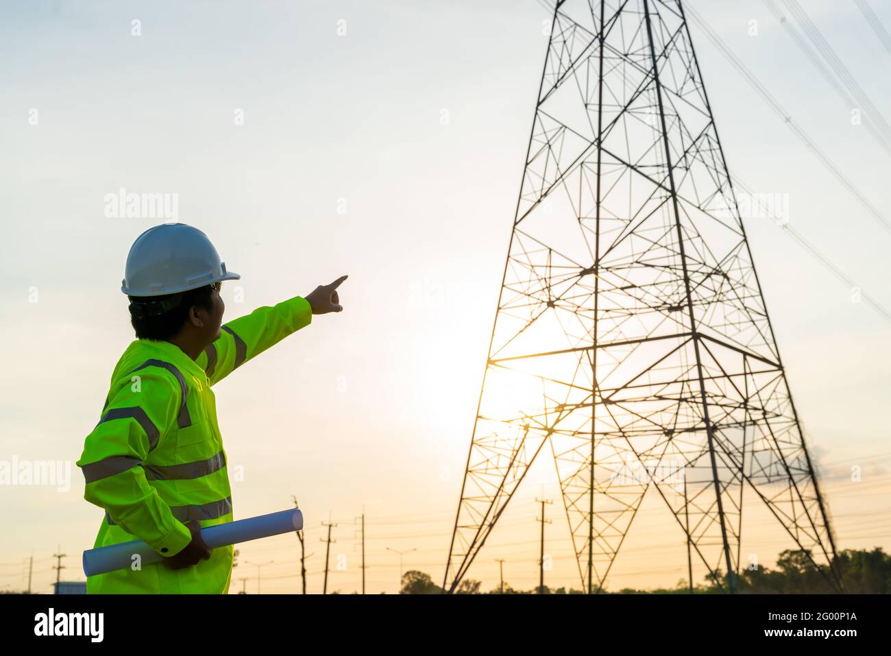 Asian an engineers working inspections at the electric power station to ...