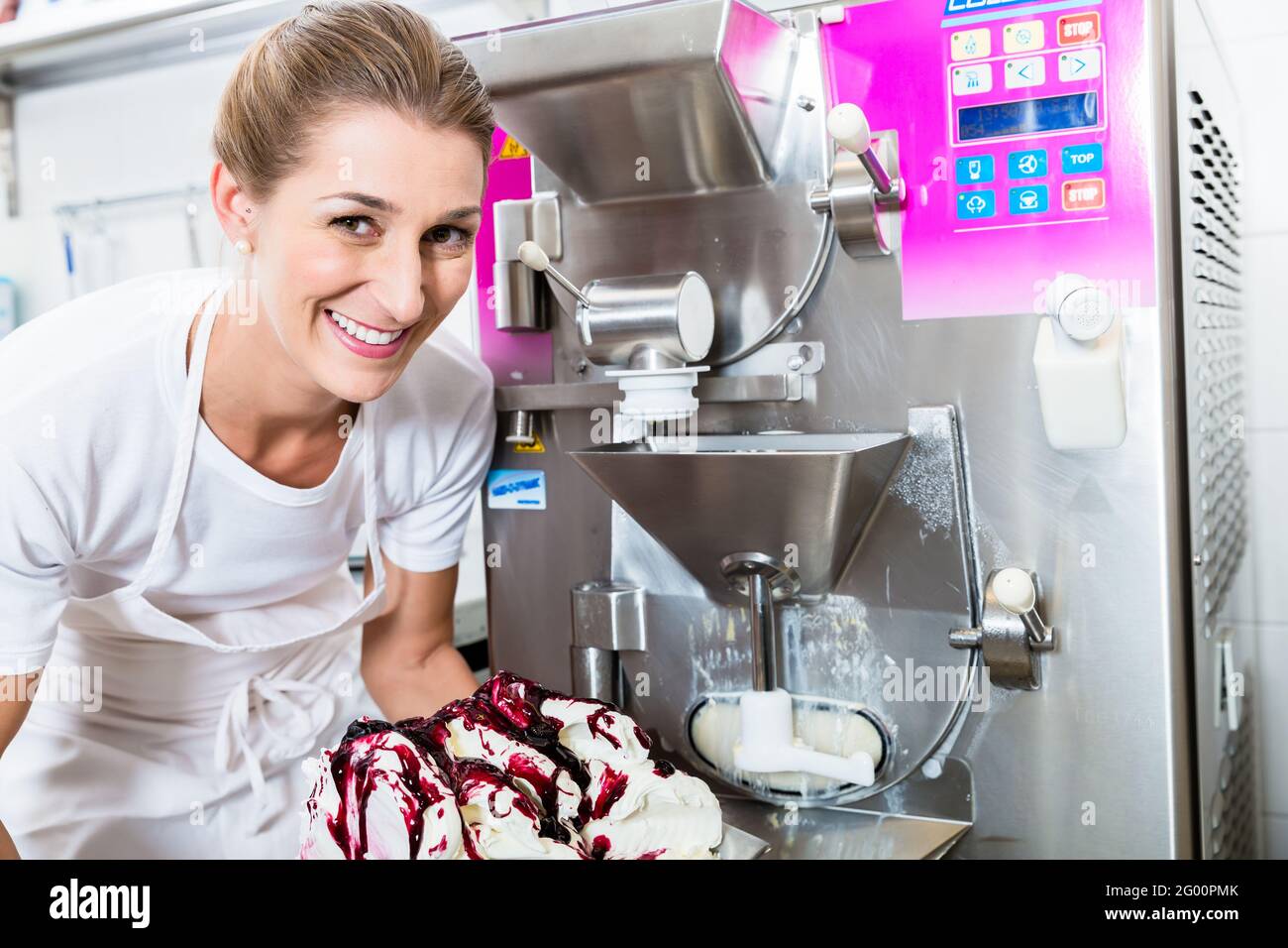 Ice cream maker in her shop at the machine Stock Photo - Alamy