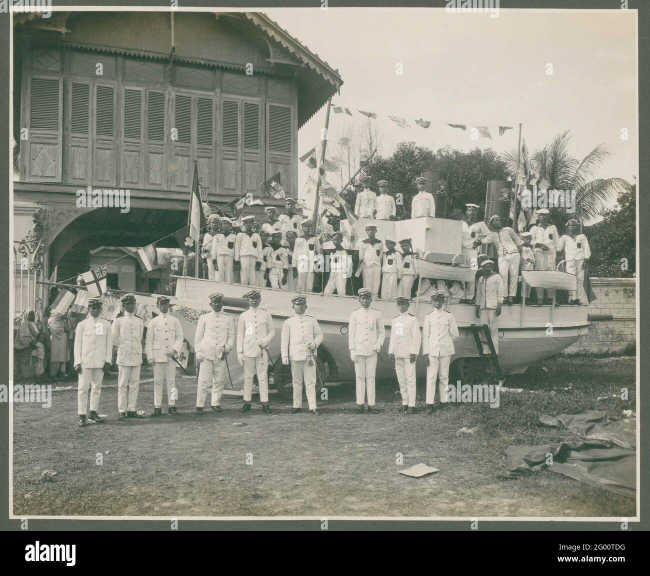 Group portrait of Indian sailors on a float for Langkat Sultan Palace ...