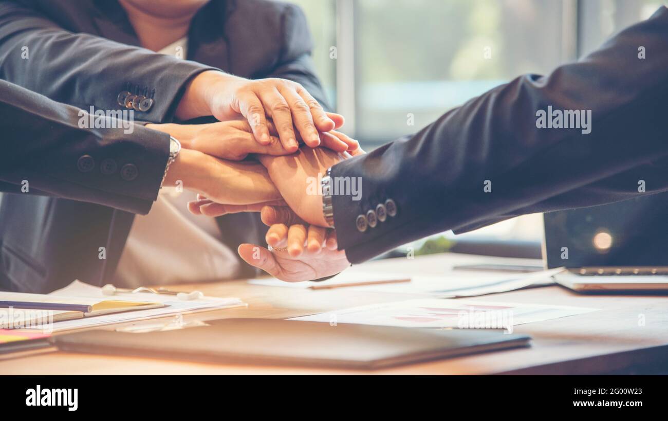 Concept partnership. Group of Photographers Partners Team with hands ...