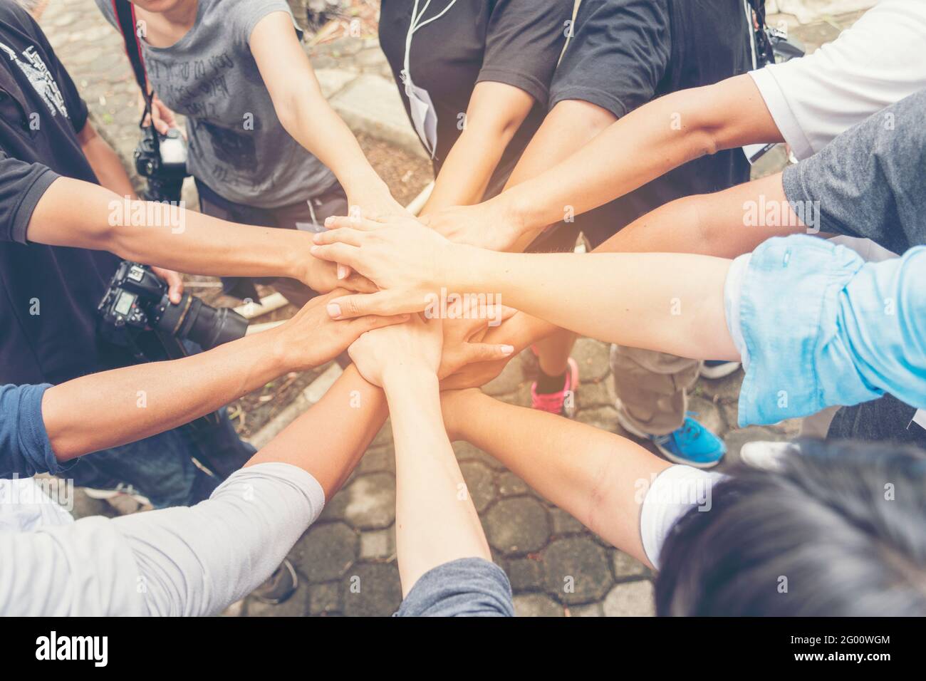 Concept partnership. Group of Photographers Partners Team with hands ...