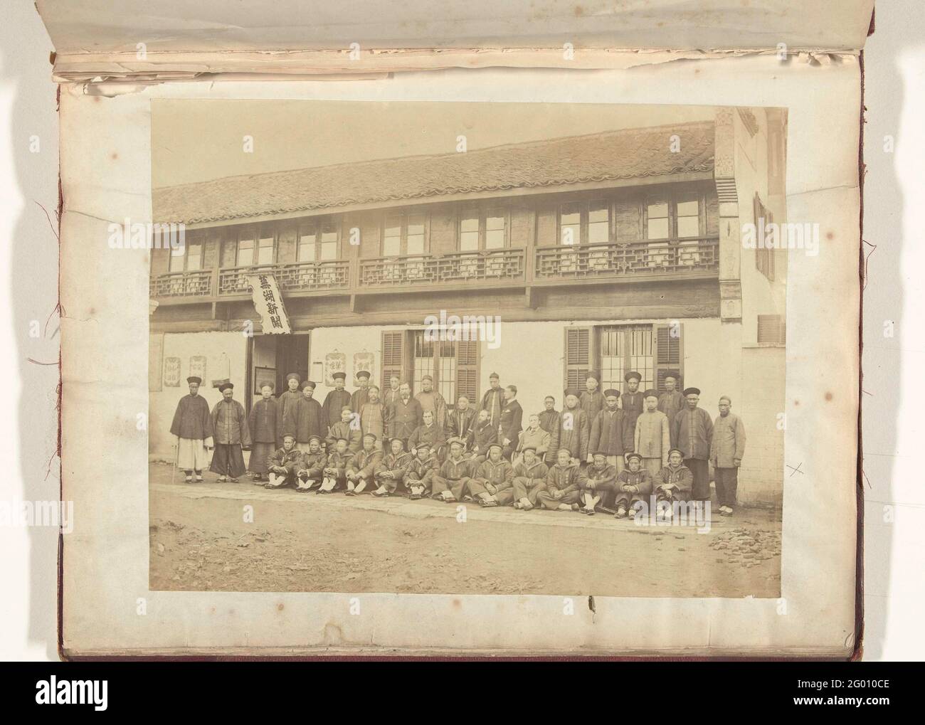 Group photo of four European men amid a group of Chinese. The Chinese ...