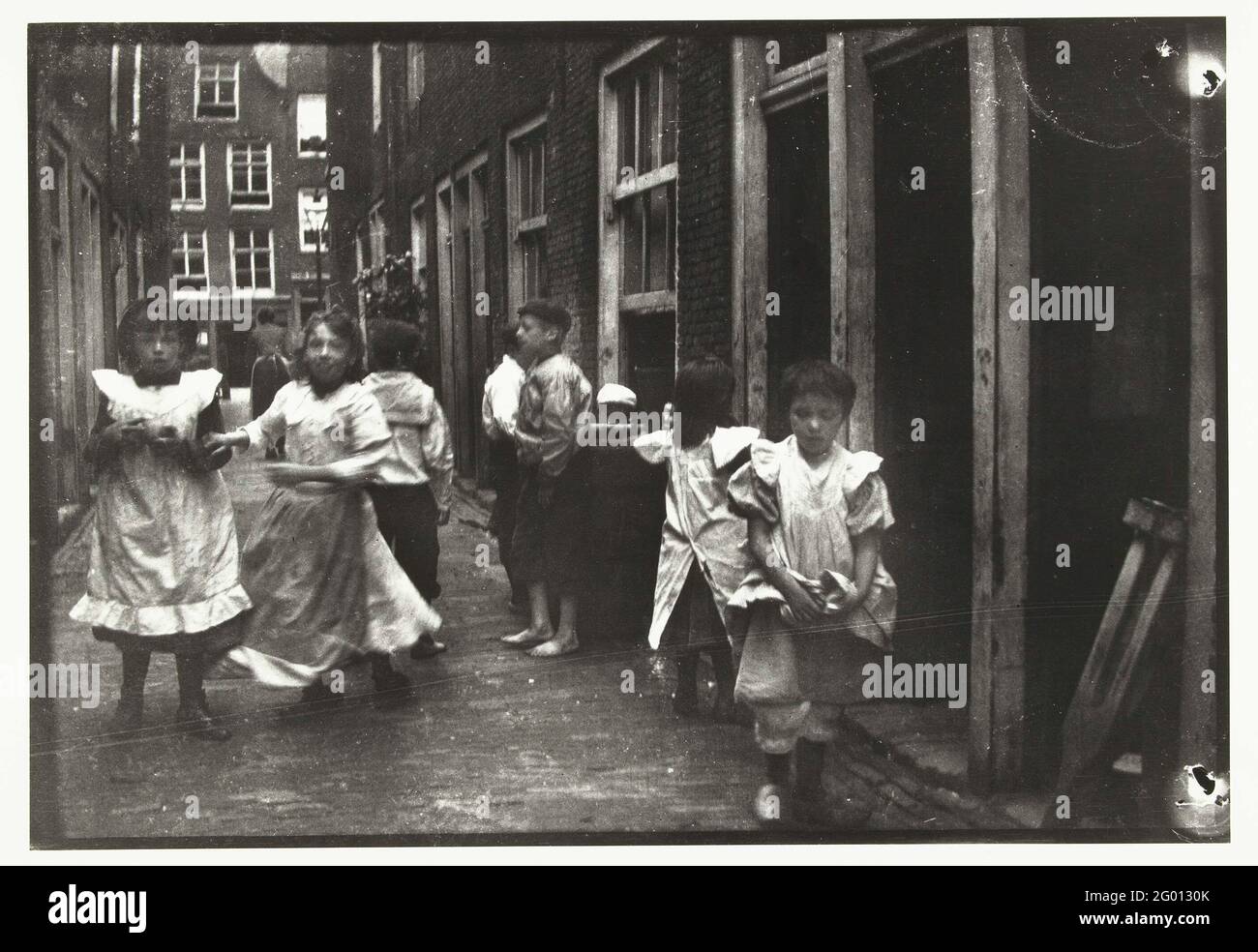 Children playing in an alley. Children in a street Stock Photo - Alamy