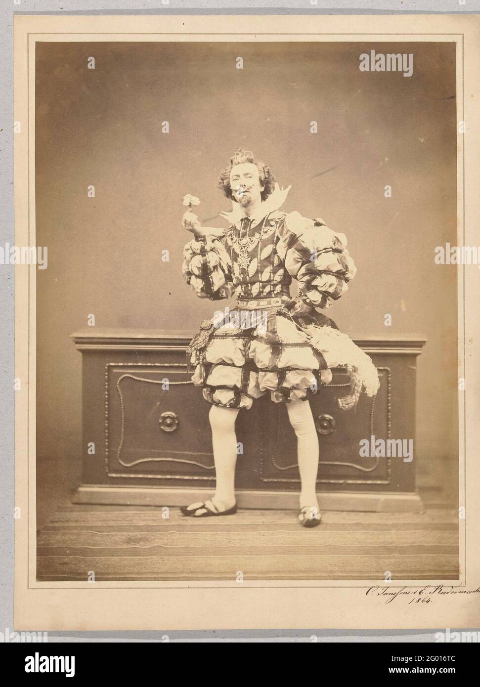 Portrait of an actor. Standing, costumed, with a flower in hand Stock ...
