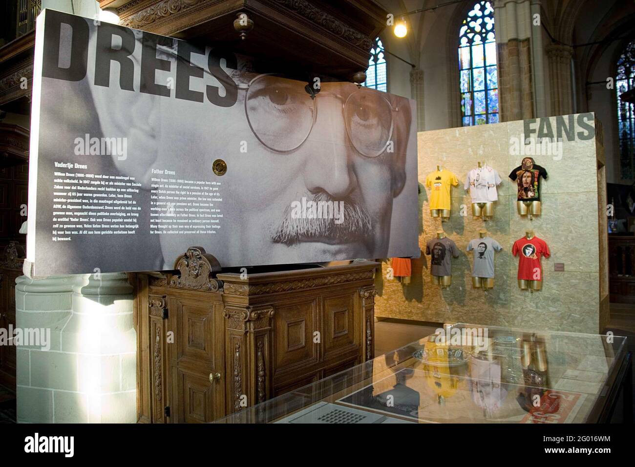 Panel with image of Willem Drees, a wall with printed t-shirts and a ...