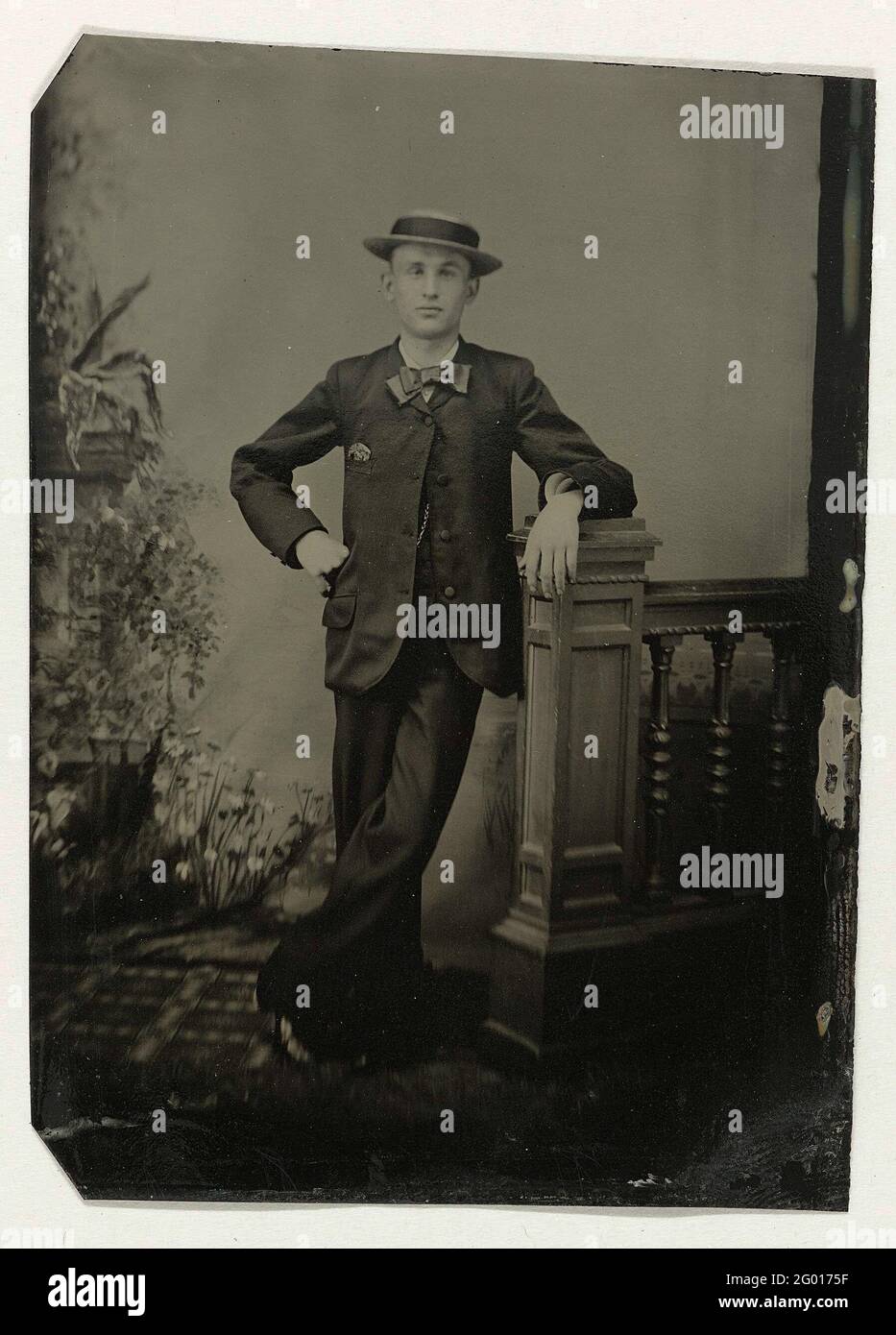 Portrait of a young man standing at a balustrade for a painted ...