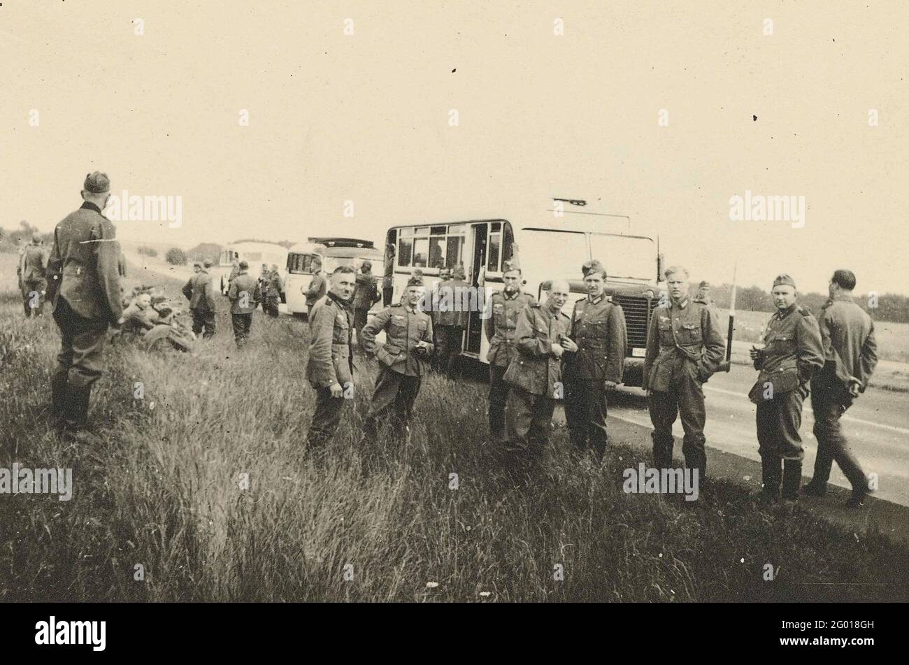 German soldiers at buses. German soldiers are on a road at a number of ...