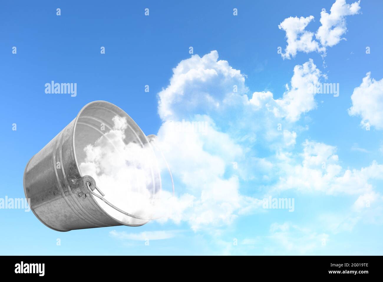 Metal bucket with white clouds in sky Stock Photo - Alamy