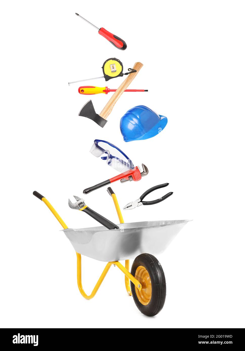 Wheelbarrow with flying construction tools on white background Stock ...