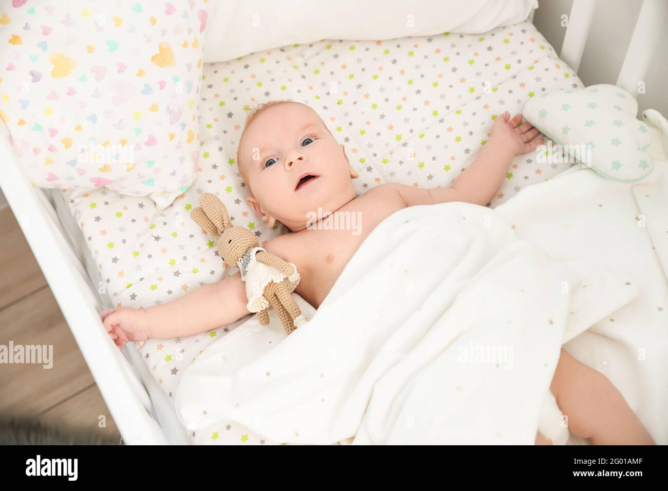 Cute little baby lying on bed at home Stock Photo - Alamy