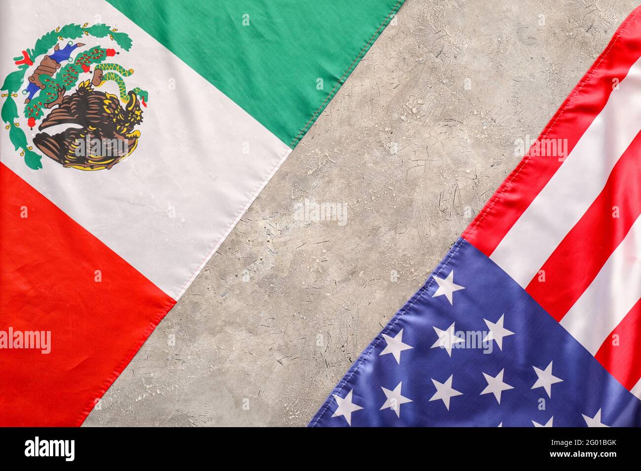 Mexican and USA flags on grey background Stock Photo - Alamy