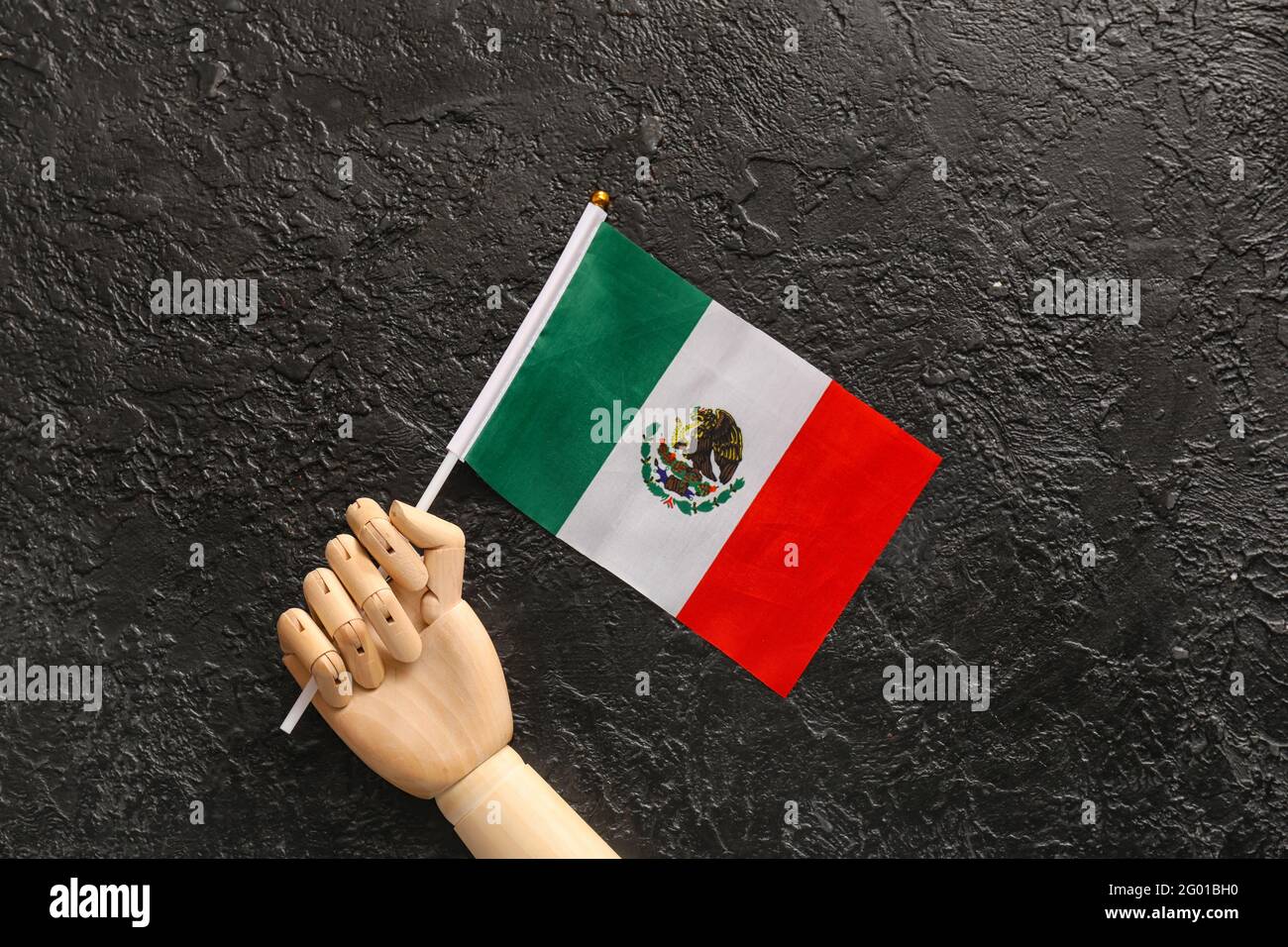 Wooden hand with Mexican flag on dark background, closeup Stock Photo ...