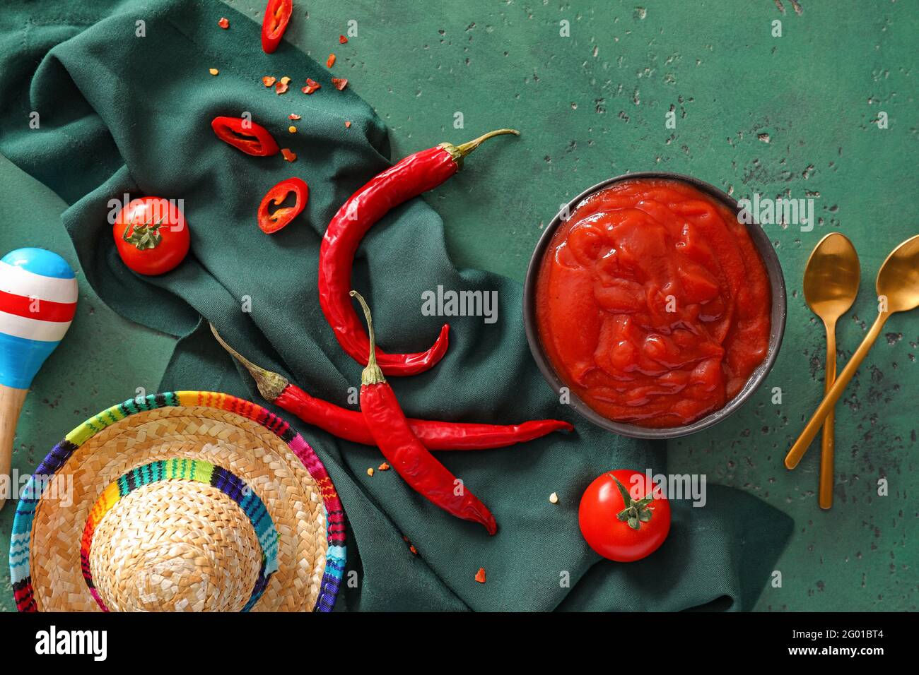 Composition with tasty chili sauce and ingredients on color background ...
