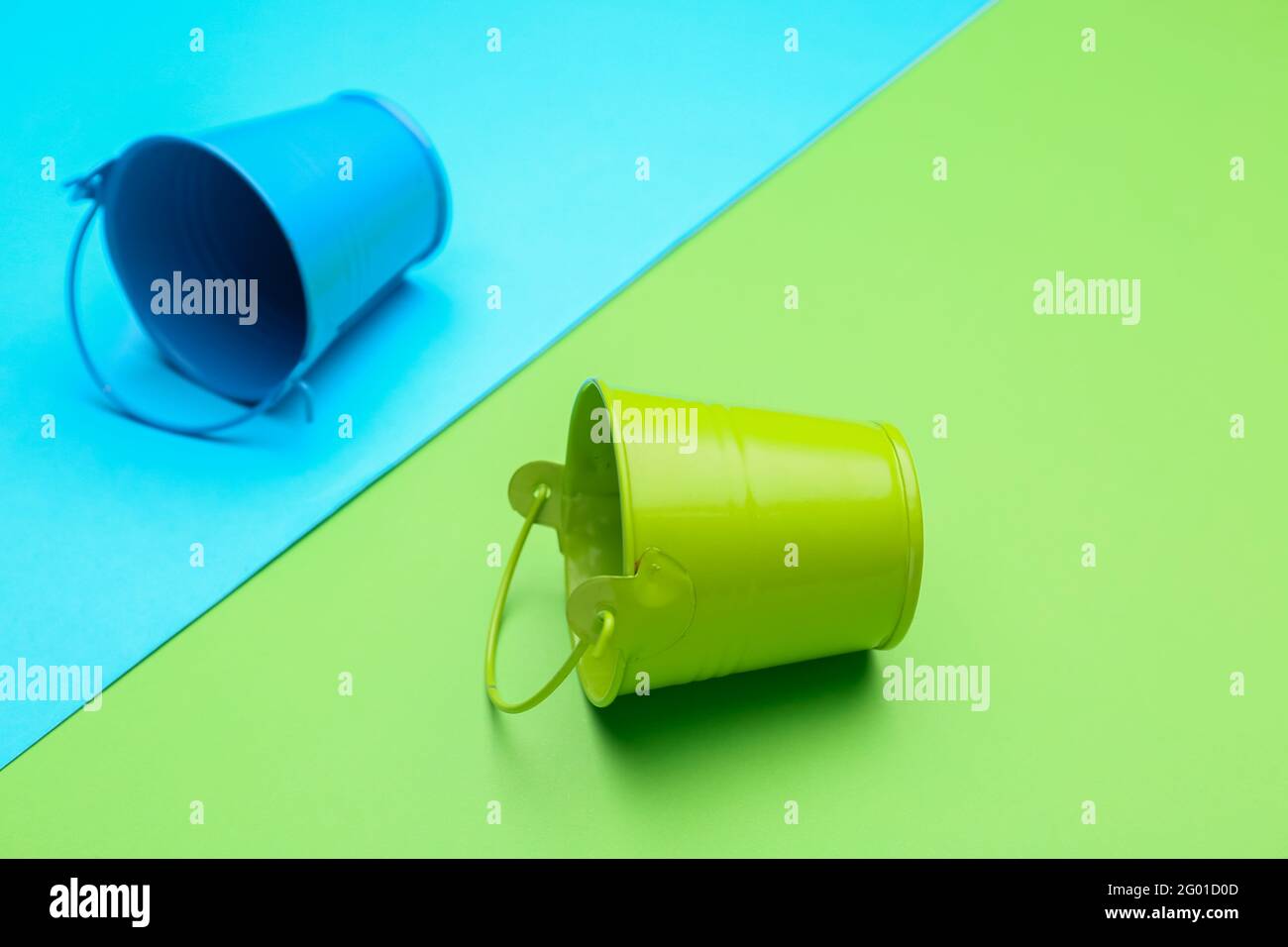 Different buckets on color background Stock Photo - Alamy