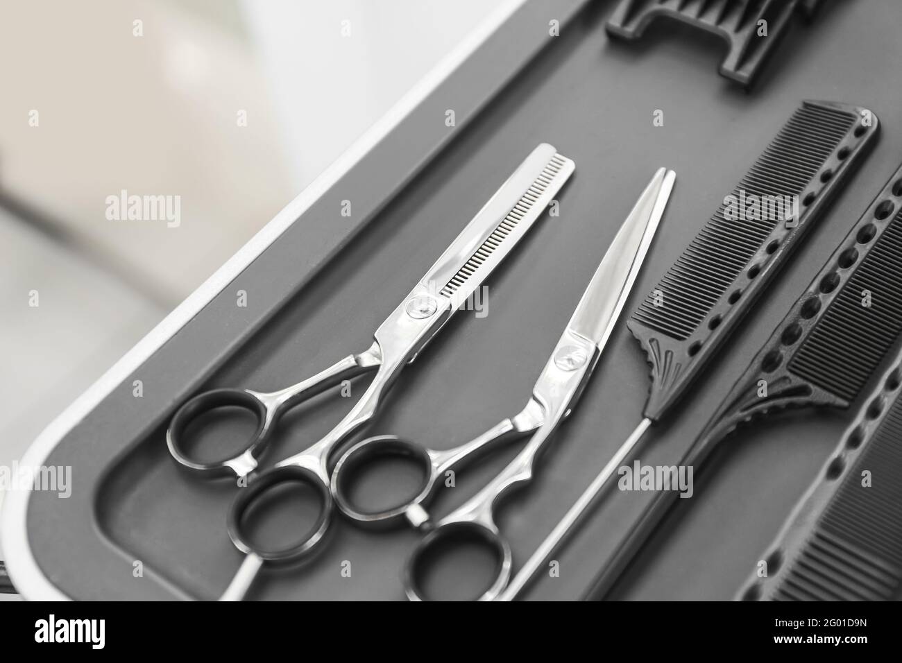Professional scissors and brushes in salon, closeup Stock Photo - Alamy