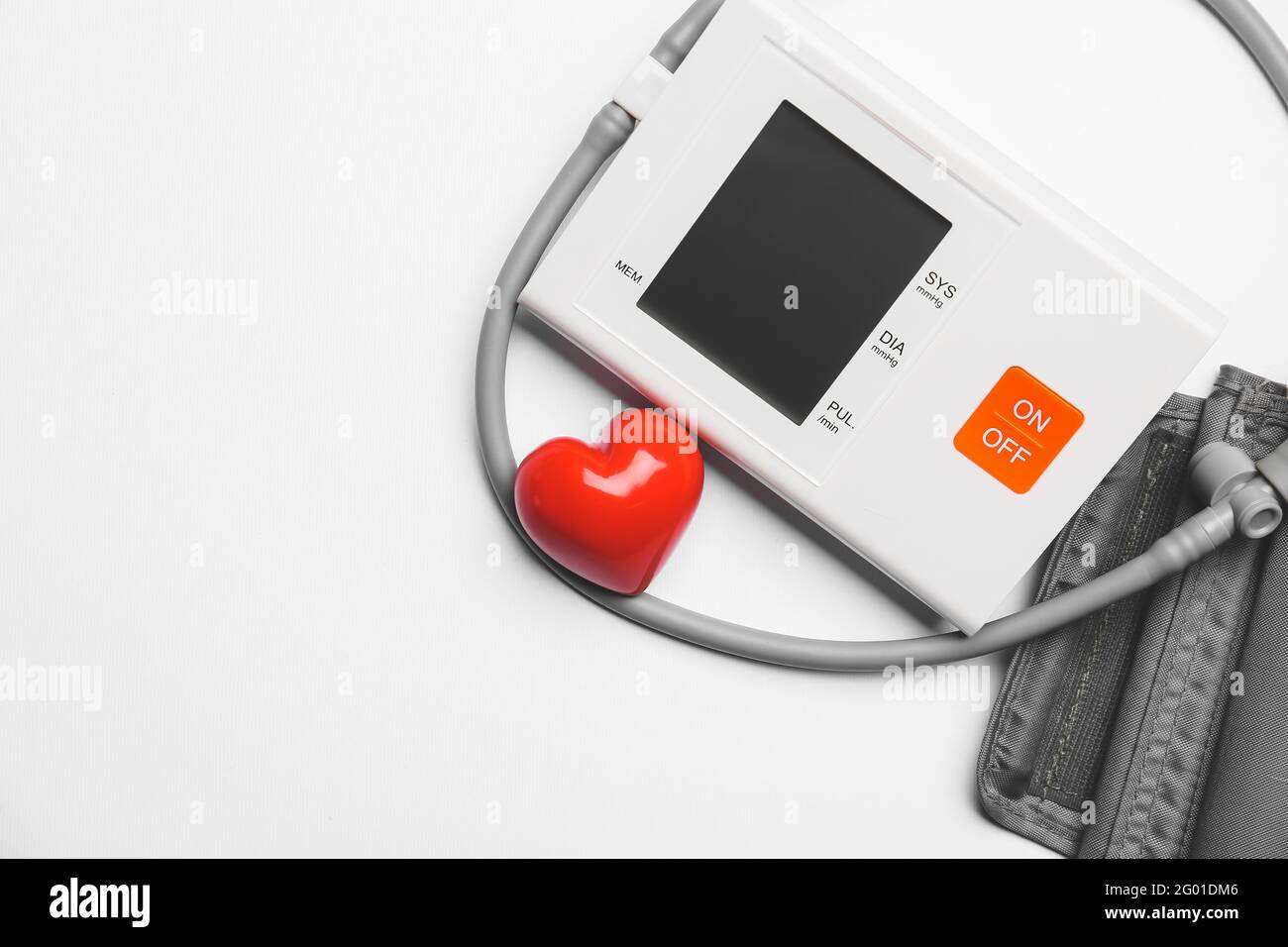 Modern sphygmomanometer with red heart on white background Stock Photo ...