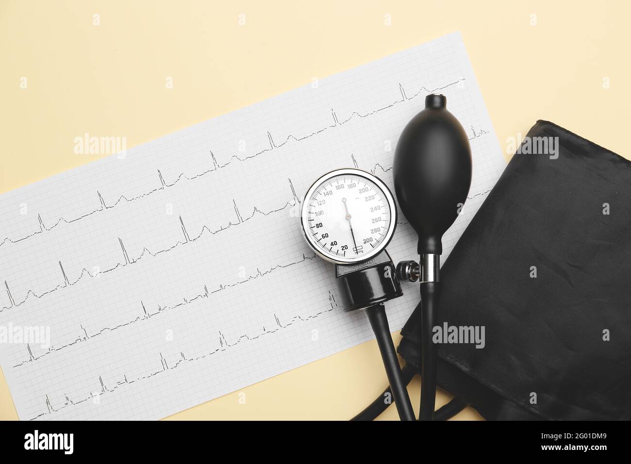 Sphygmomanometer with cardiogram on color background Stock Photo - Alamy