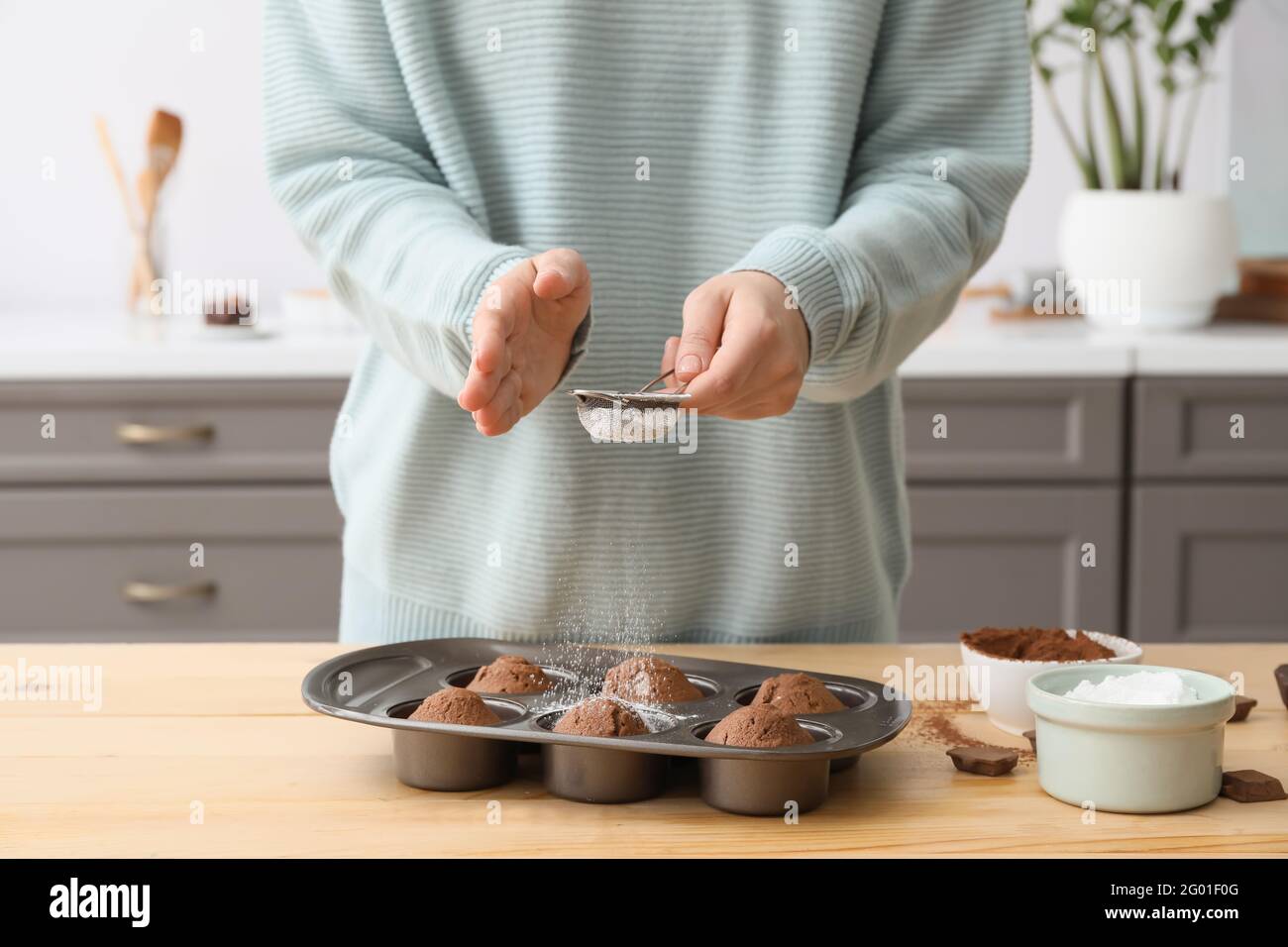 Woman cooking cupcakes in hi-res stock photography and images - Alamy
