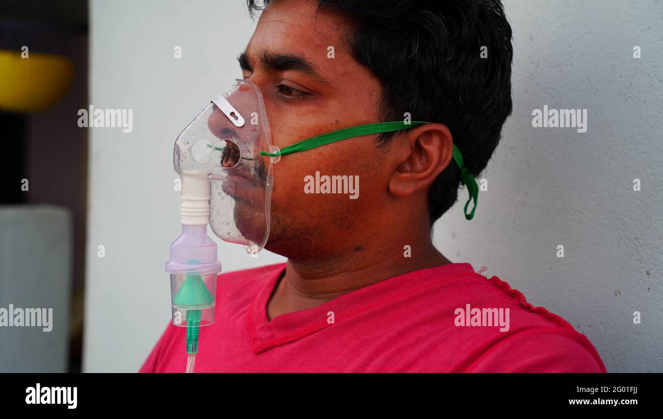 Old indian man with inhaler hi-res stock photography and images - Alamy