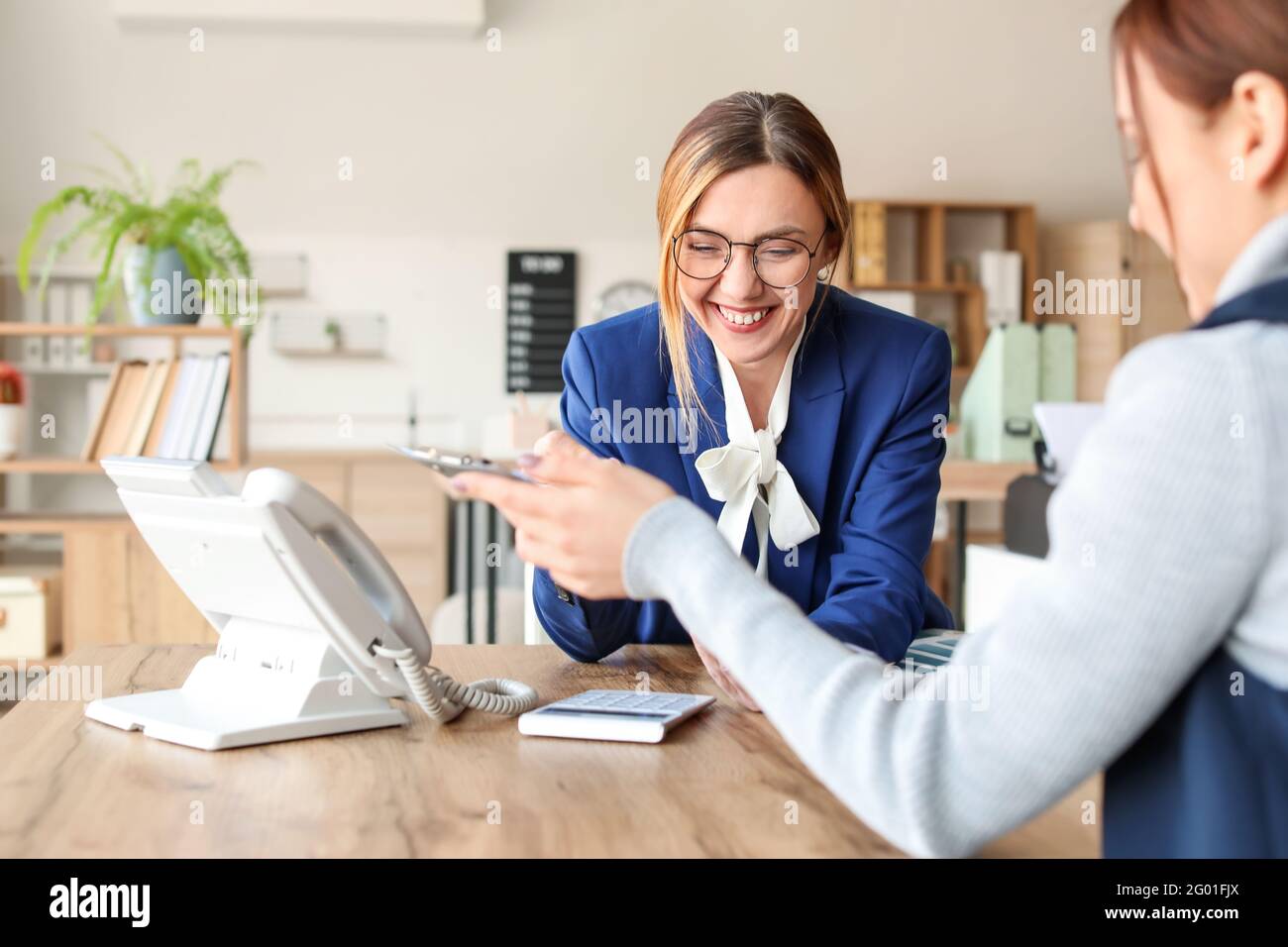 Female accountant working in office Stock Photo - Alamy