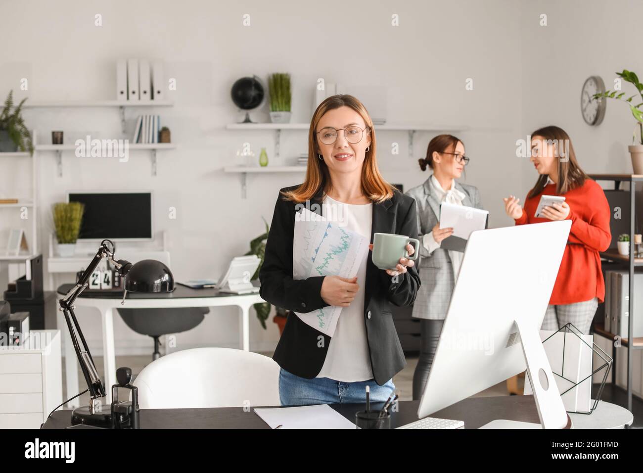 Female accountant working in office Stock Photo - Alamy