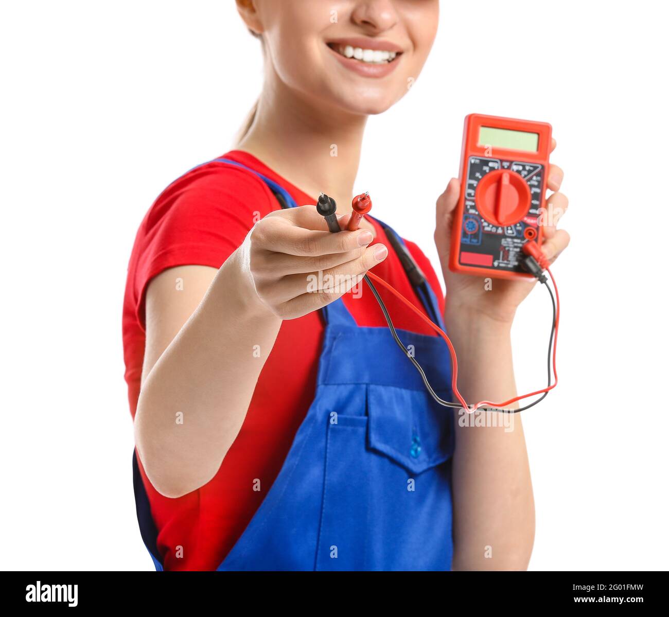 Young female electrician with multimeter on white background Stock ...