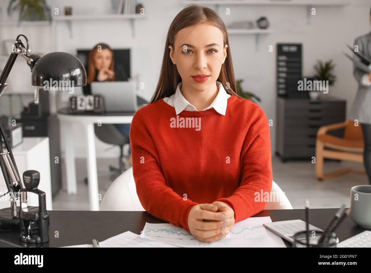 Female accountant working in office Stock Photo - Alamy