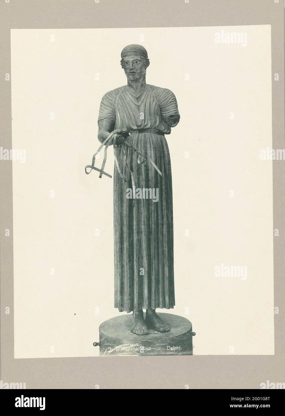 Bronze statue of standing wagon maker; 2 Bronze Charioteer Delphi Stock ...