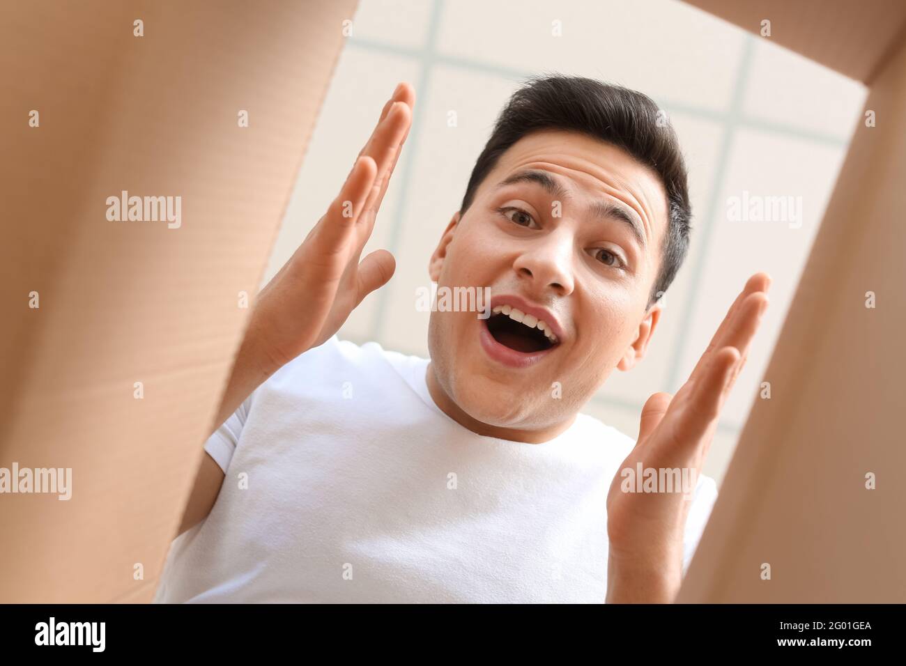 Happy male customer open parcel hi-res stock photography and images - Alamy