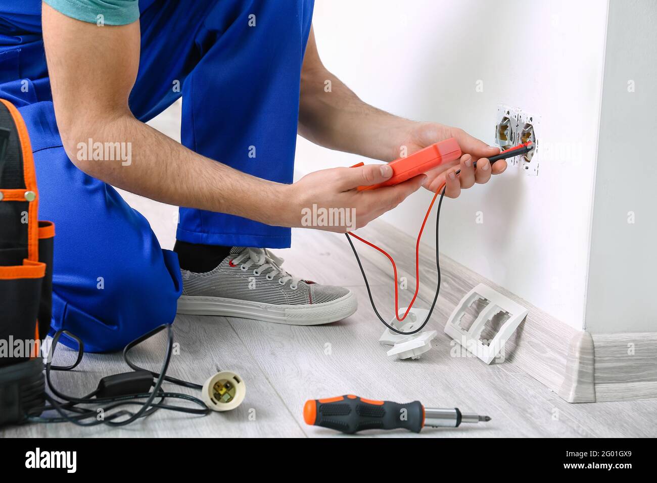 Male hands measuring voltage in hi-res stock photography and images - Alamy