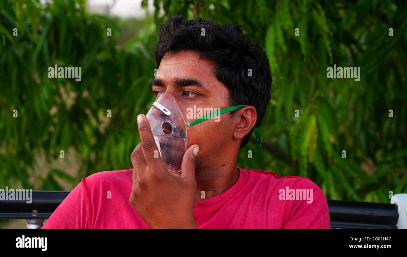 Old indian man with inhaler hi-res stock photography and images - Alamy