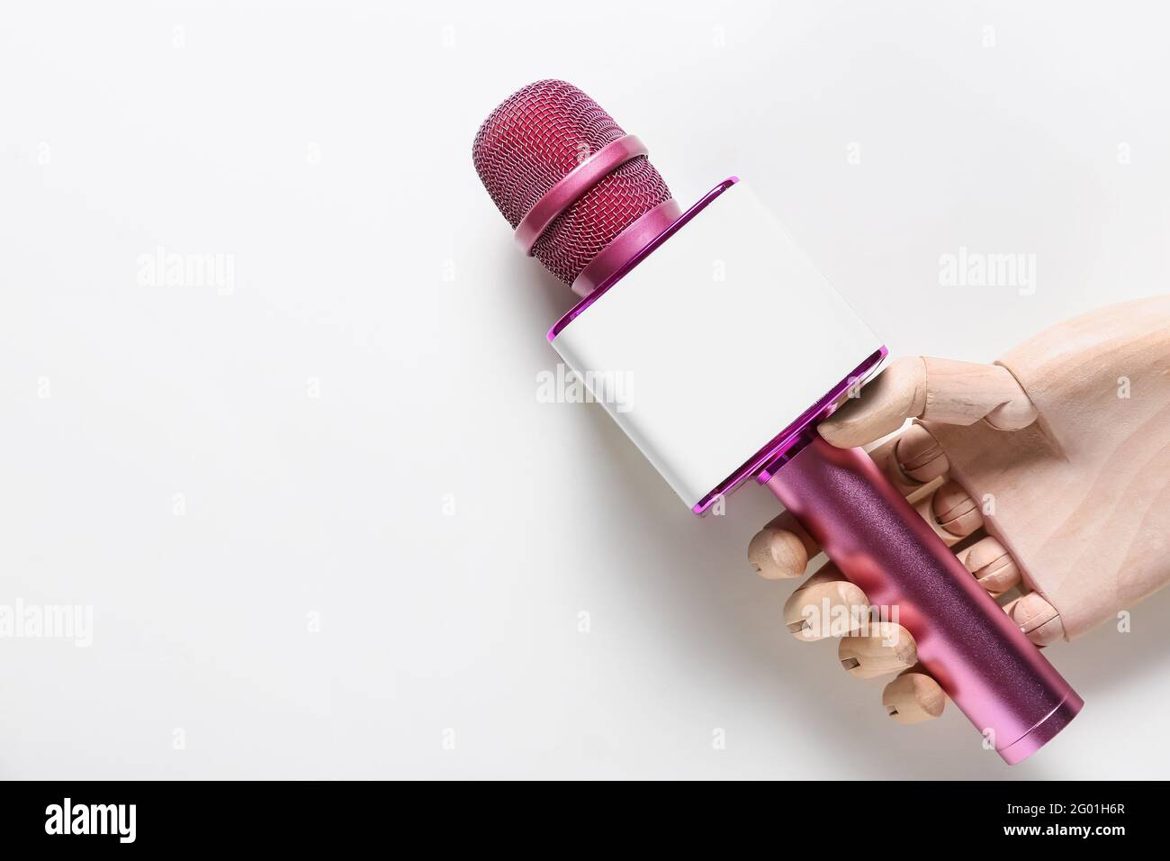 Wooden hand with modern microphone on white background Stock Photo - Alamy
