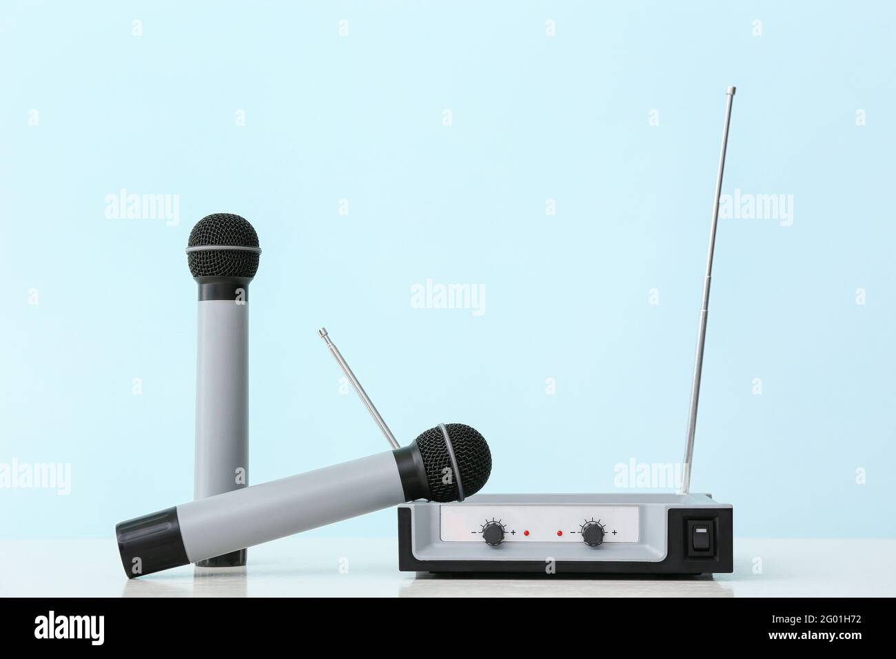 Modern microphones and audio system on color background Stock Photo - Alamy