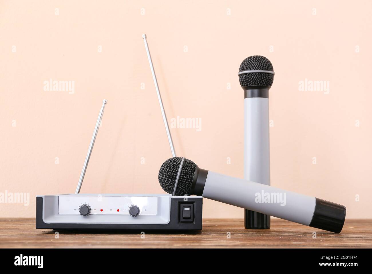 Modern microphones with audio system on color background Stock Photo ...