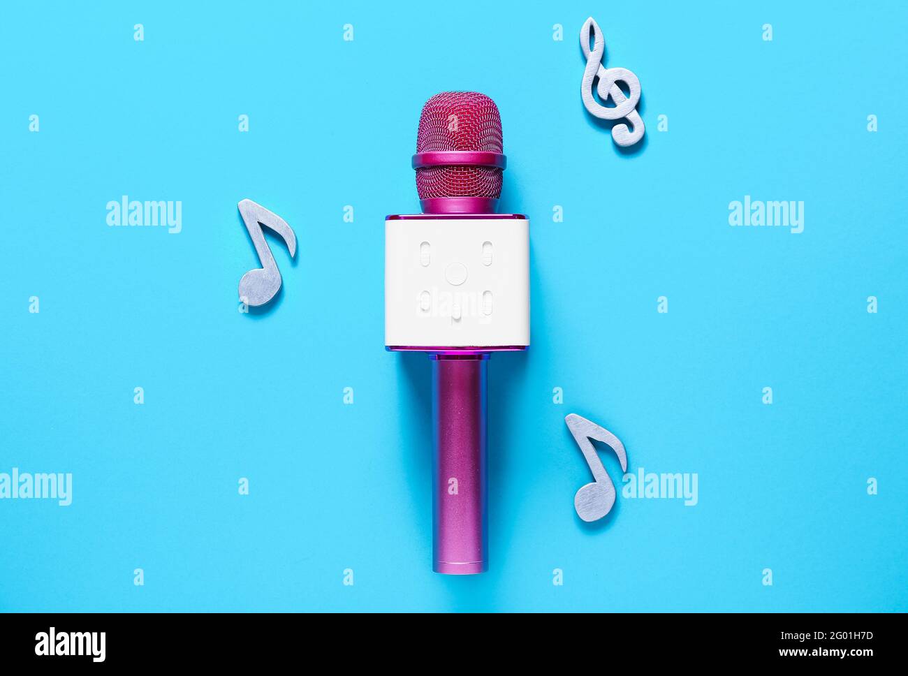 Modern microphone with music notes on color background Stock Photo - Alamy