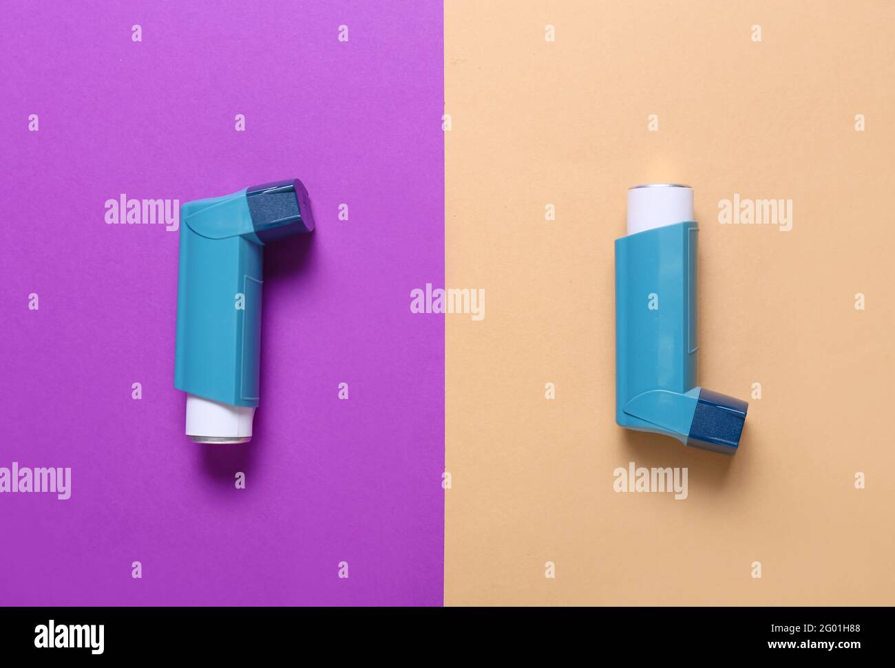 Modern inhalers on color background Stock Photo - Alamy