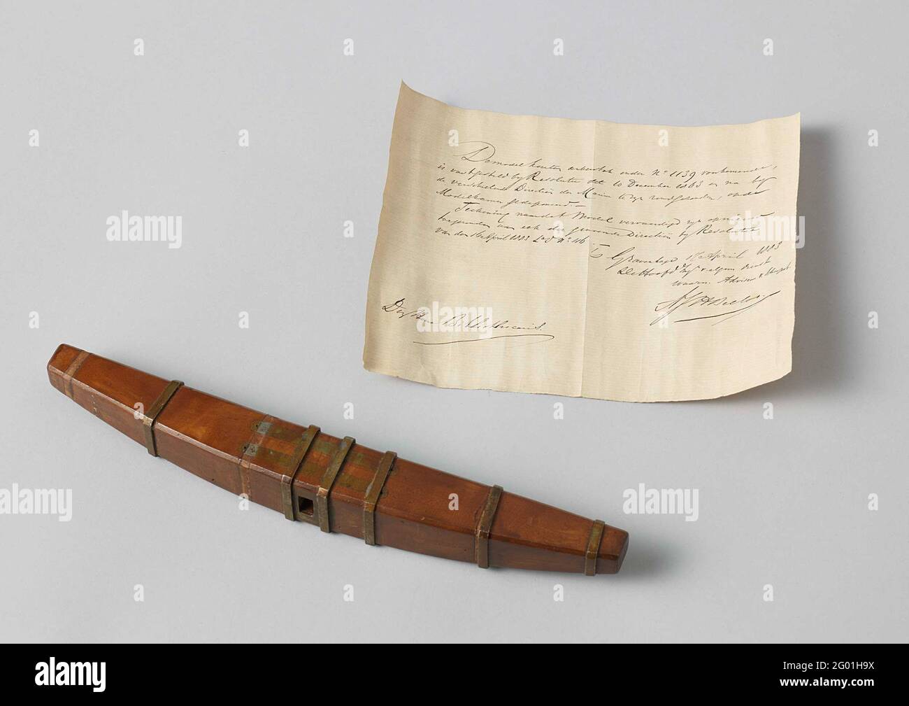 Model of an Anchor stock and accompanying note. Model of a wooden ...