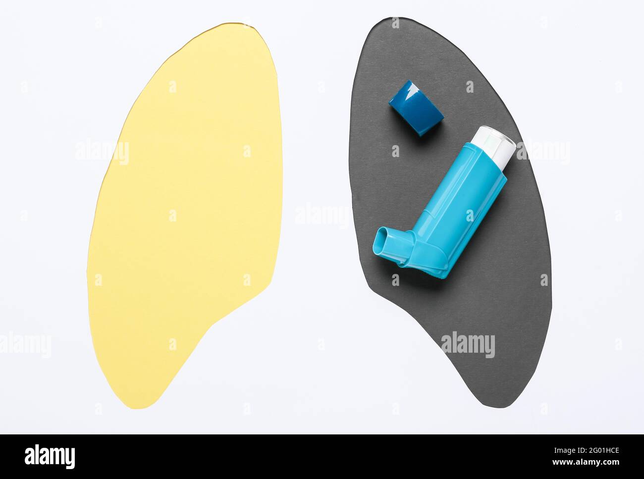 Creative composition with inhaler and lungs made of paper on white ...