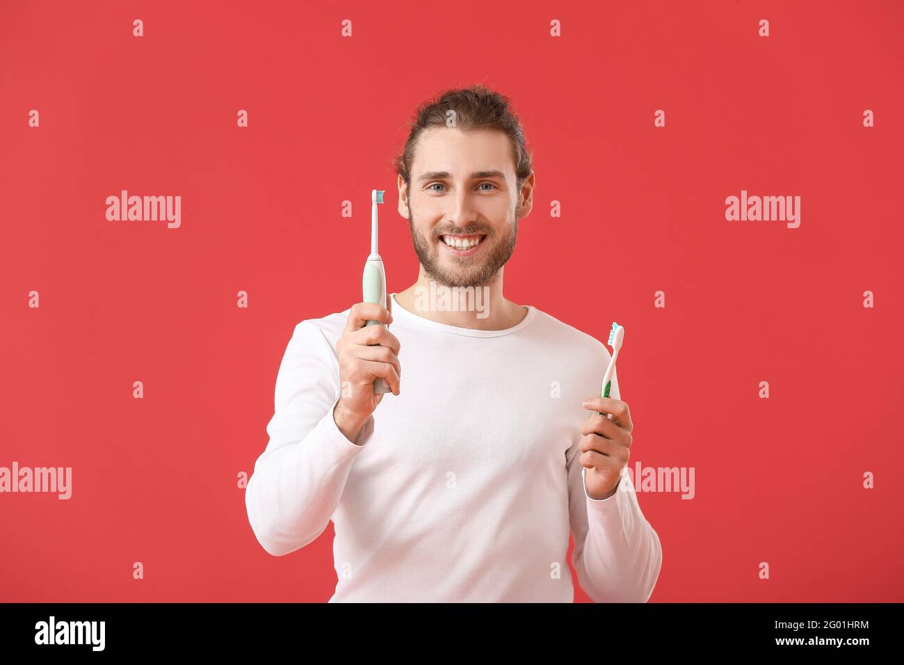 Handsome guy brushes teeth hi-res stock photography and images - Alamy