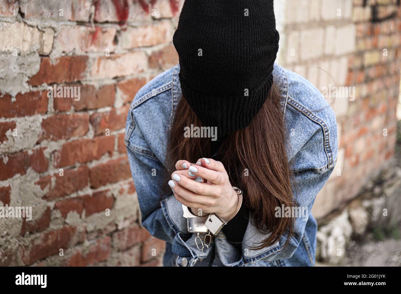 Female hostage with handcuffs outdoors Stock Photo - Alamy