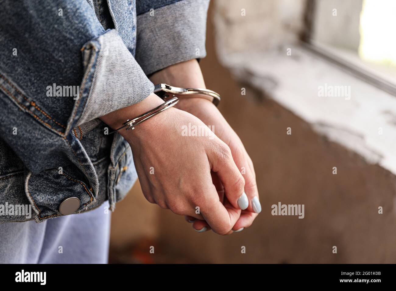 Female hostage with handcuffs outdoors Stock Photo - Alamy