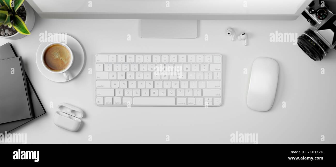 3D rendering, white computer table with coffee cup, camera and supplies ...