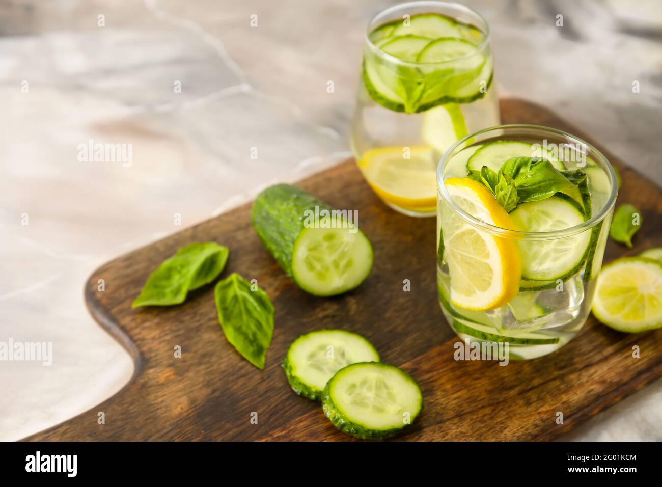 Glasses with cucumber lemonade on table Stock Photo - Alamy